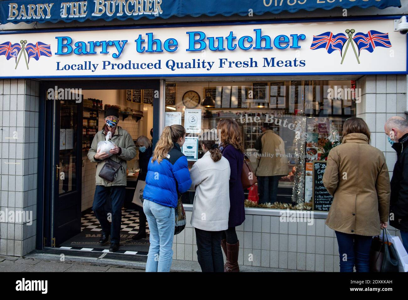 People queue outside Barry the Butcher in Stratford-upon-Avon on ...