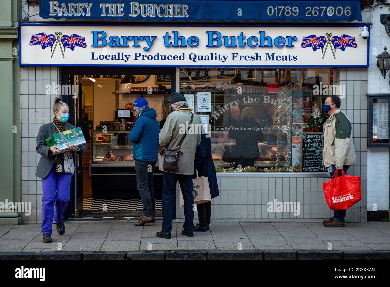 People queue outside Barry the Butcher in Stratford-upon-Avon on ...