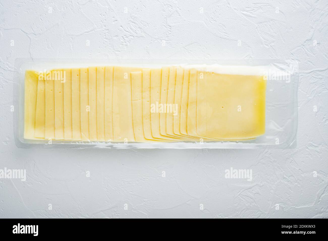 Slices of american cheese plastic pack, on white background Stock Photo ...
