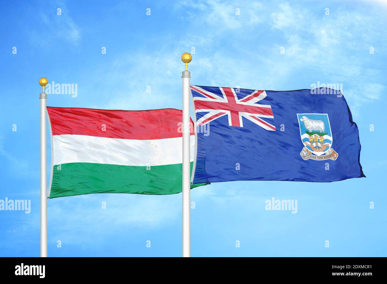 Hungary and Falkland Islands two flags on flagpoles and blue cloudy sky ...