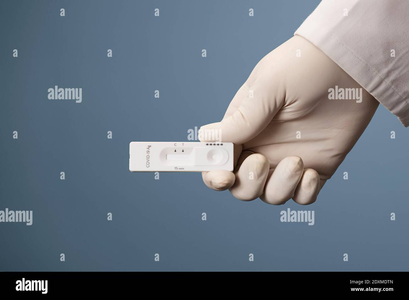 Doctor holding a test kit for viral disease, COVID-19 SARS-CoV-2 lab ...