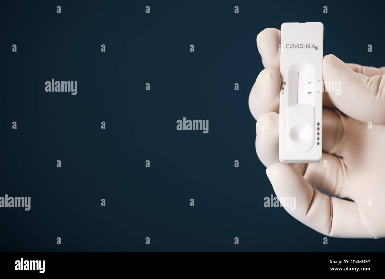 Doctor holding a test kit for viral disease, COVID-19 SARS-CoV-2 lab ...