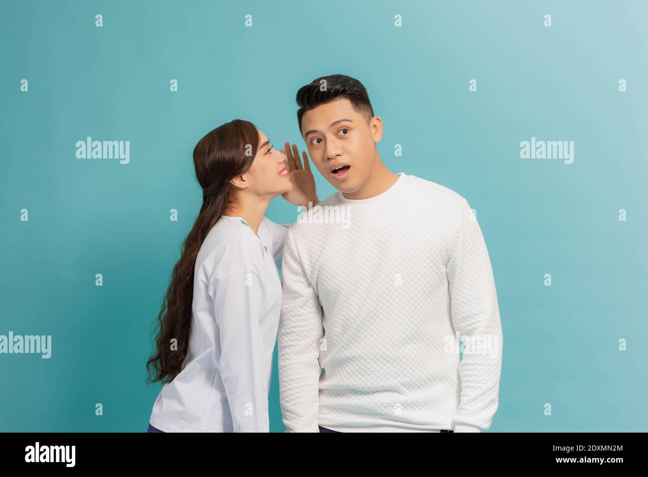 Woman telling boyfriend secret hi-res stock photography and images - Alamy