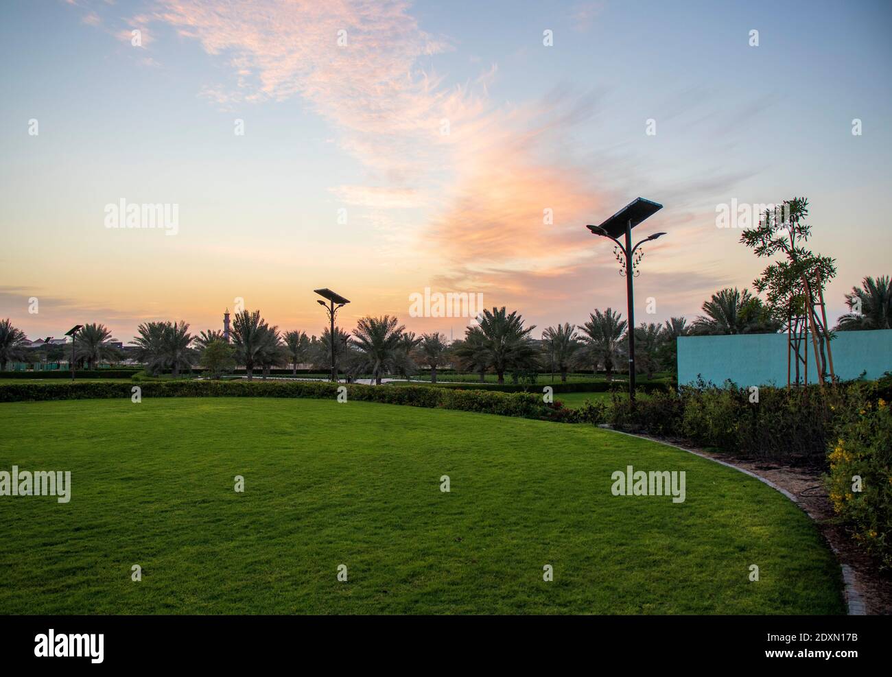 Watering lawn sunset hi-res stock photography and images - Alamy
