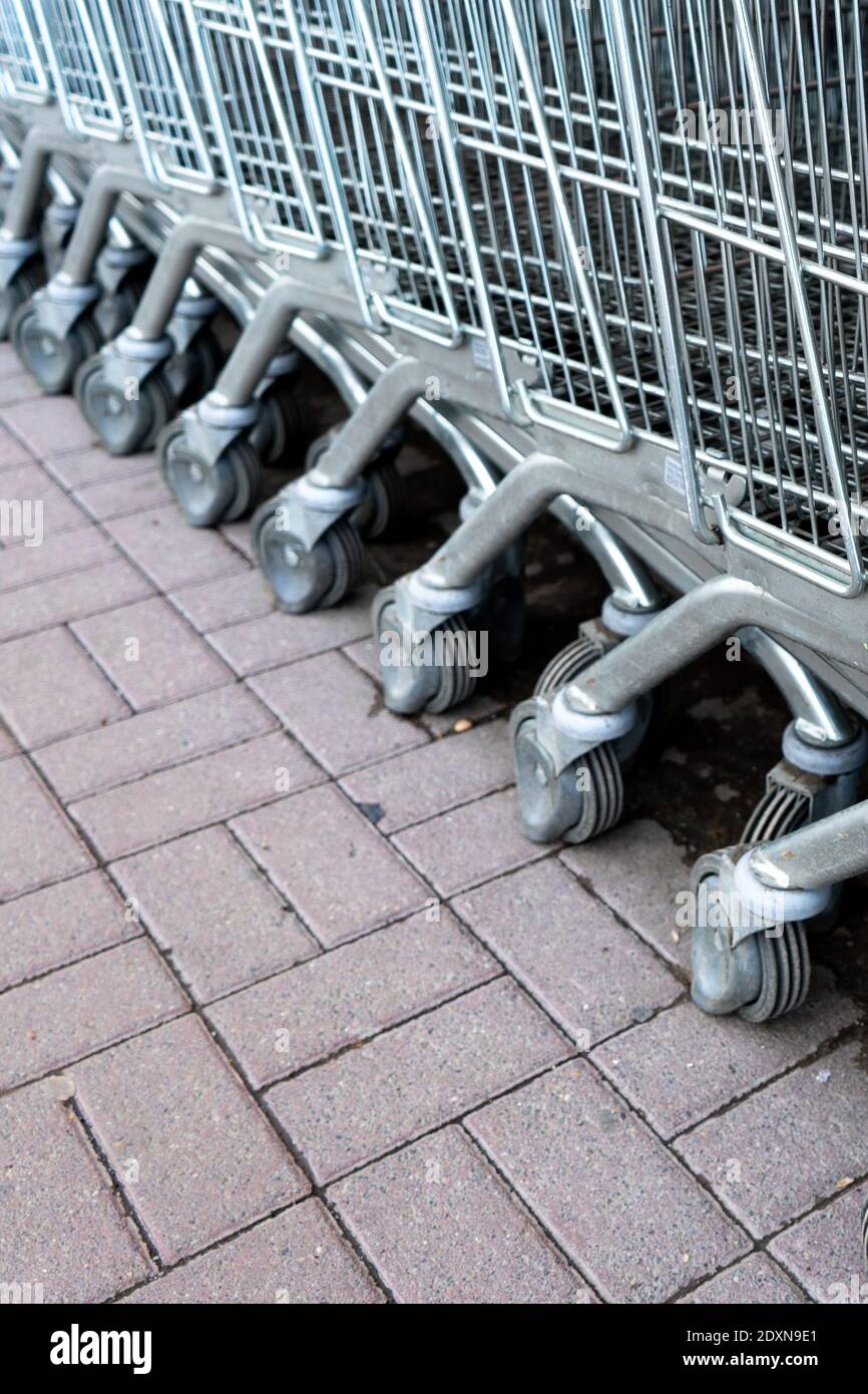 There are Empty Carts in a Row Outside the Supermarket Stock Photo - Alamy