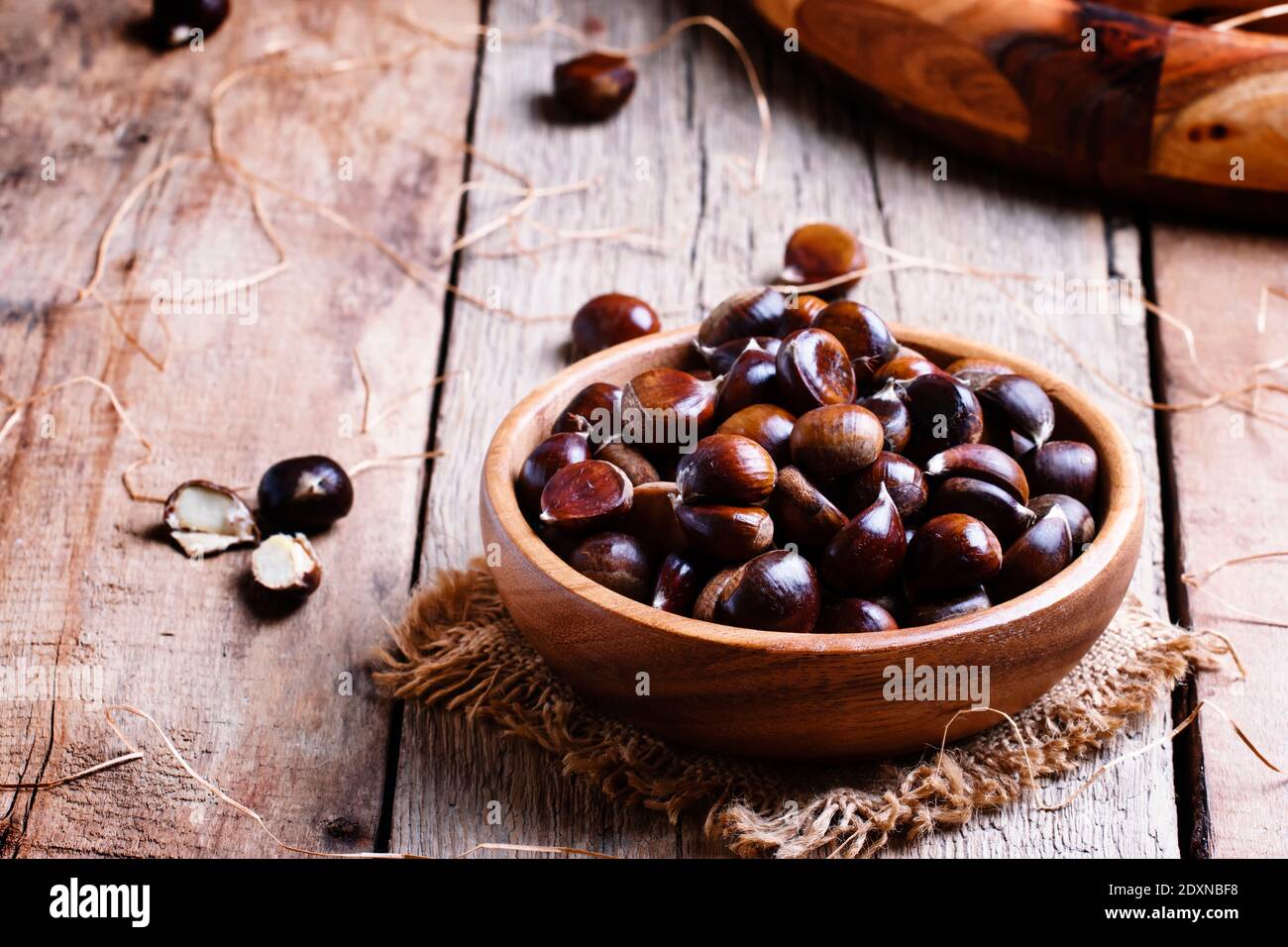Fresh edible chestnuts in bowl, still life in rustic style, vintage ...