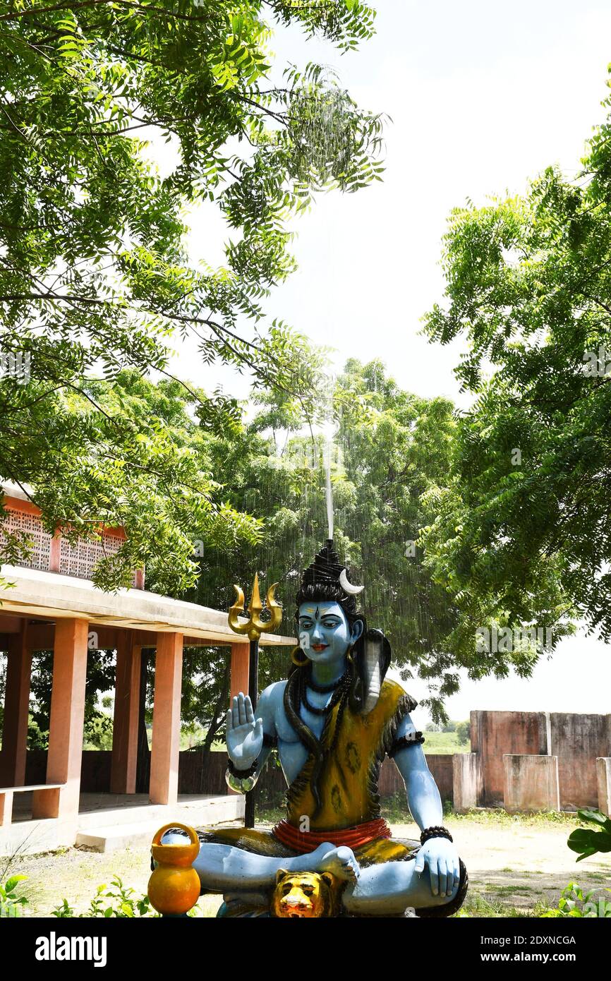 Statue of lord Shiva and Background raining Stock Photo - Alamy