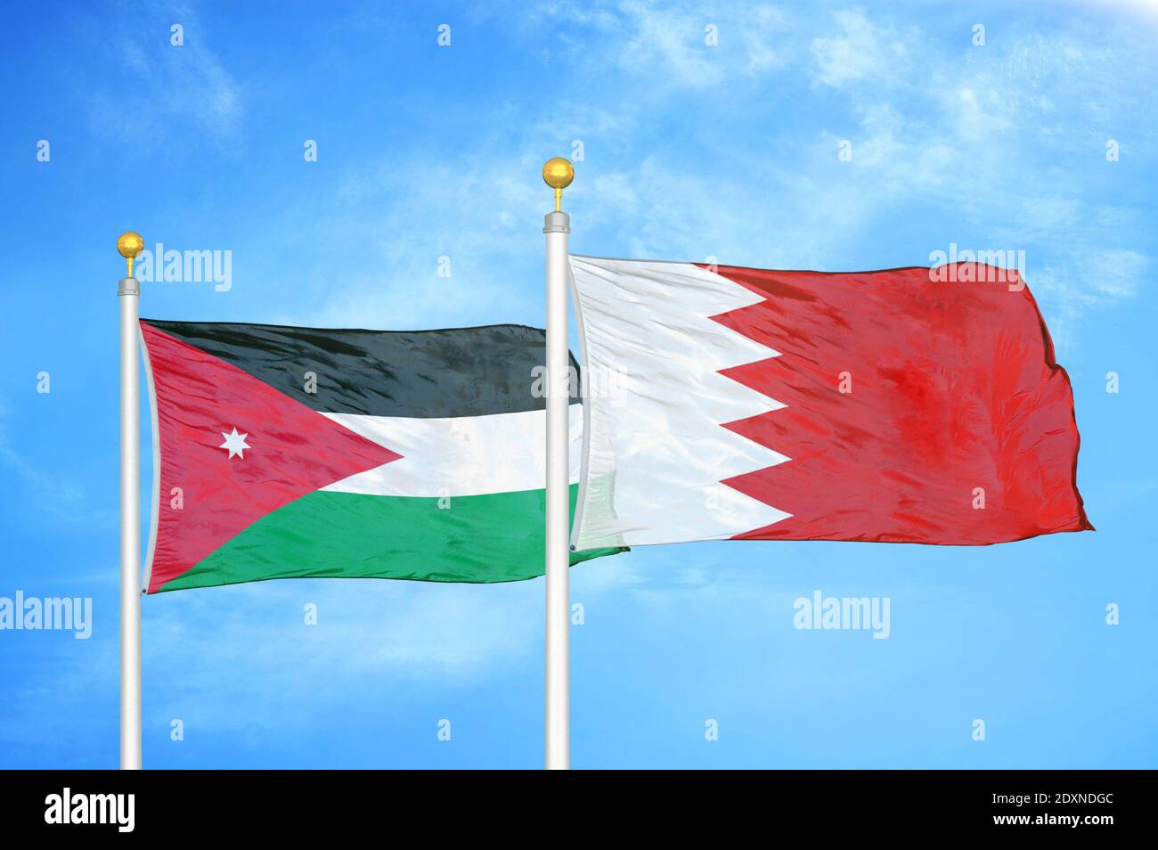 Jordan and Bahrain two flags on flagpoles and blue cloudy sky Stock ...