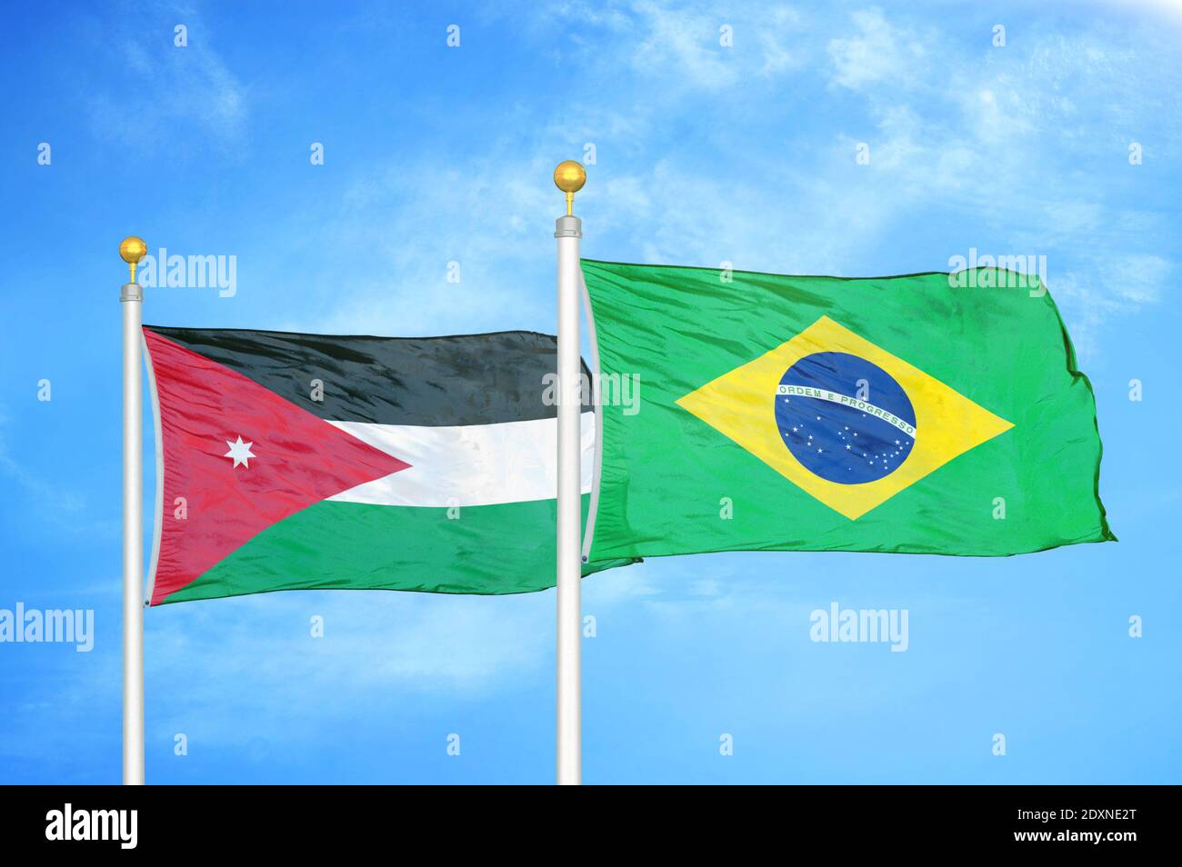 Jordan and Brazil two flags on flagpoles and blue cloudy sky Stock ...