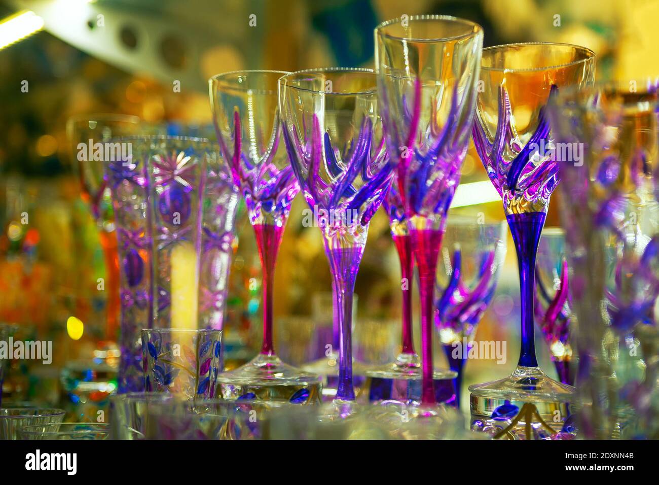 Colorful glass cups on the showcase Stock Photo - Alamy
