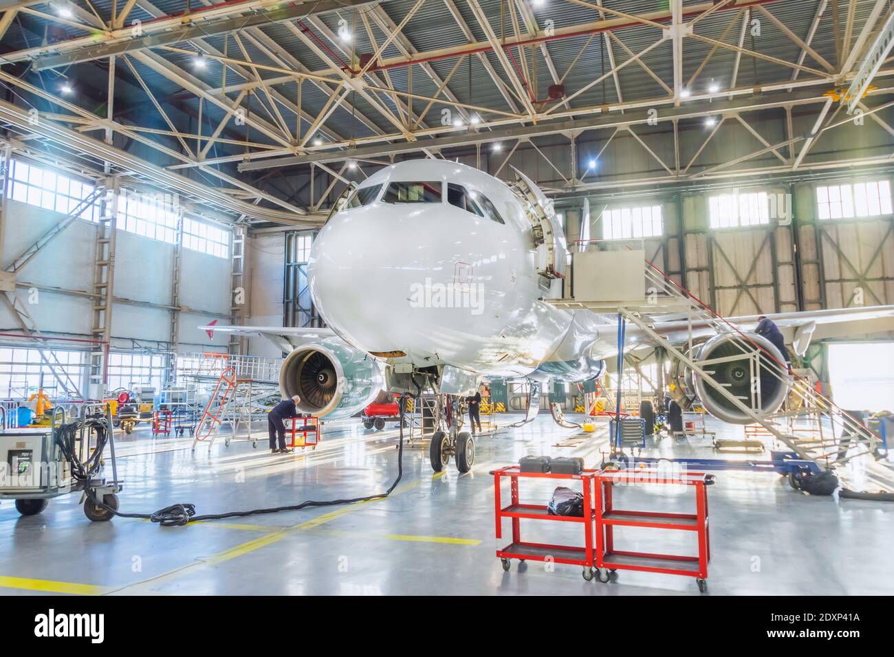 Aircraft inside the aviation hangar, maintenance service. Airplane ...