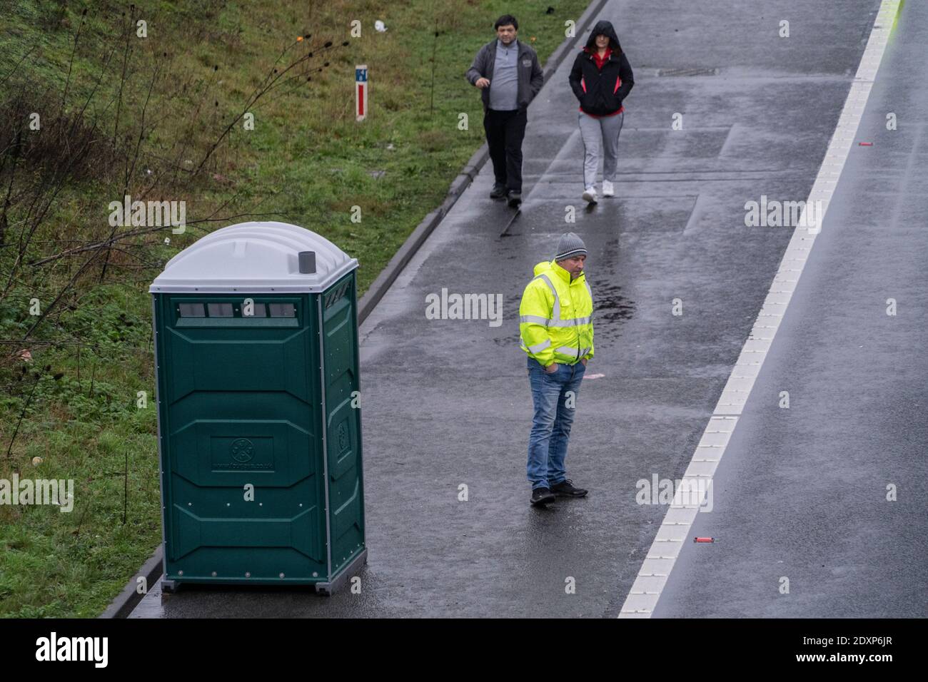Trucker waits to use the toilet on the M20 motorway in Kent, UK, 23.12. ...