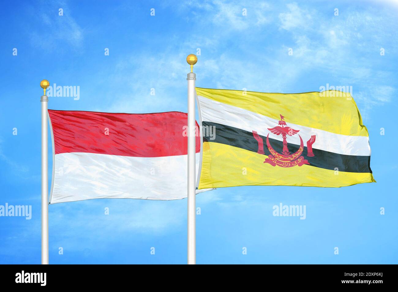 Indonesia and Brunei two flags on flagpoles and blue cloudy sky Stock ...