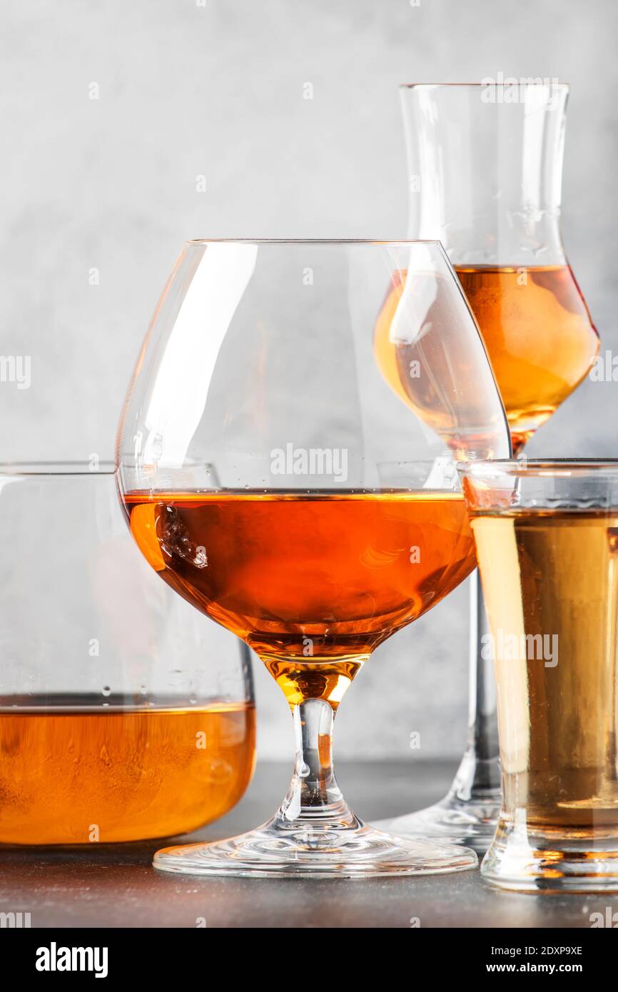 Set of hard strong alcoholic drinks and spirits in glasses in ...