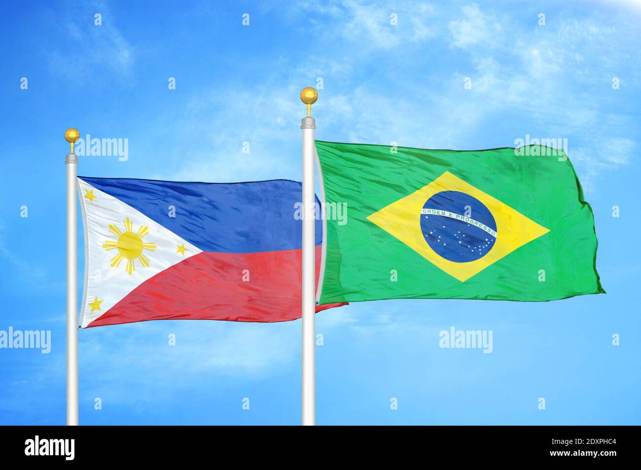 Philippines and Brazil two flags on flagpoles and blue cloudy sky Stock ...