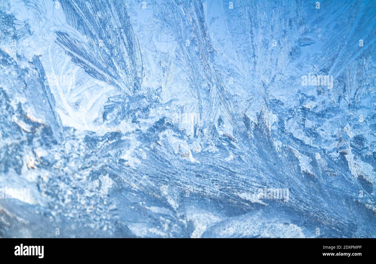 Beautiful natural frosty pattern on glass window Stock Photo - Alamy