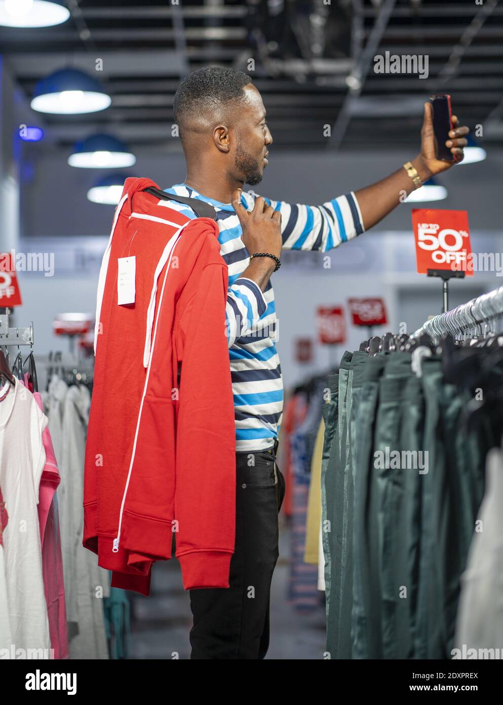 African american shopping holding bags and a phone hi-res stock ...