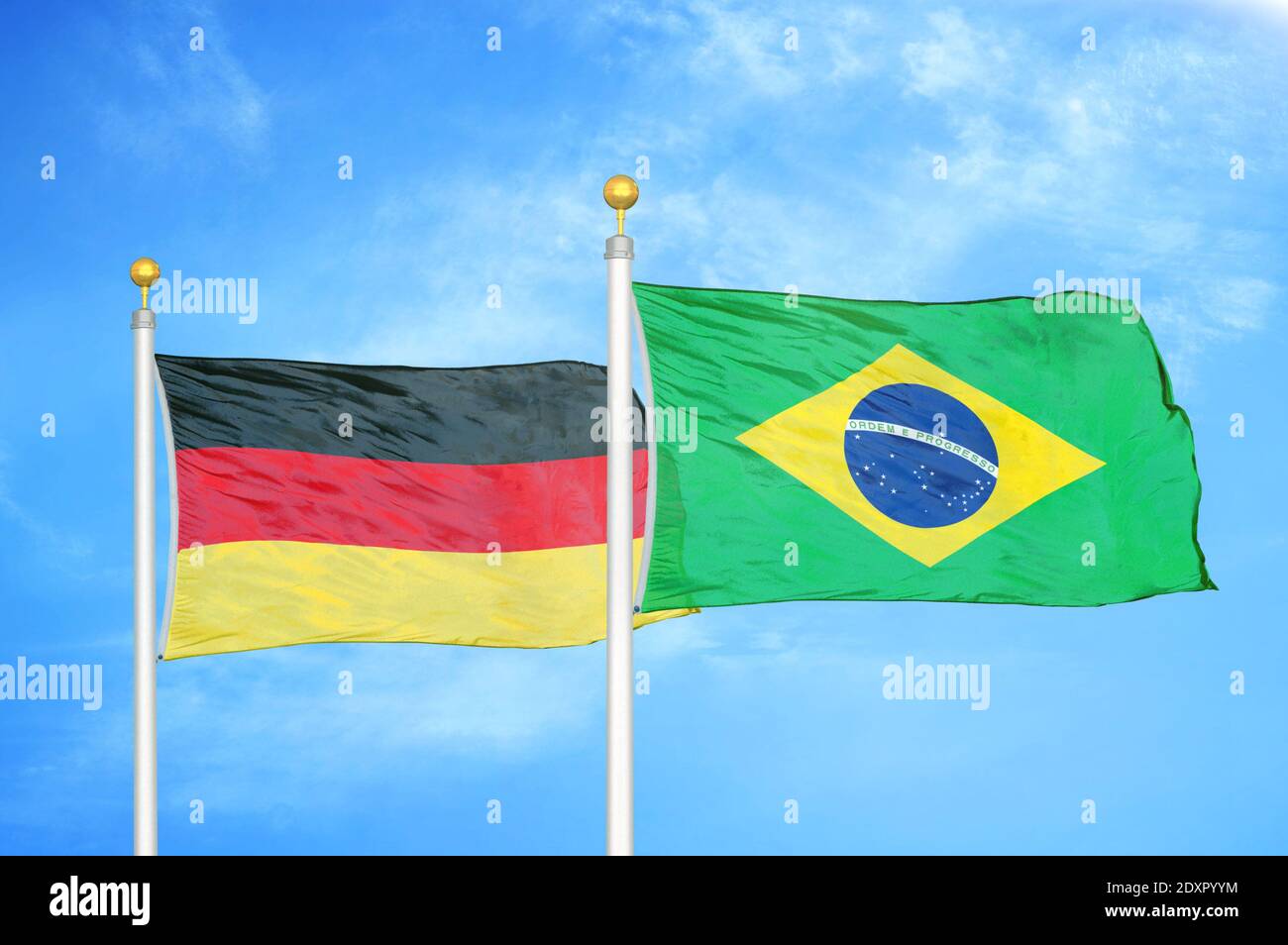 Germany and Brazil two flags on flagpoles and blue cloudy sky Stock ...