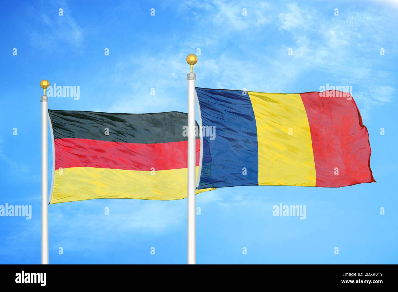 Germany and Chad two flags on flagpoles and blue cloudy sky Stock Photo ...