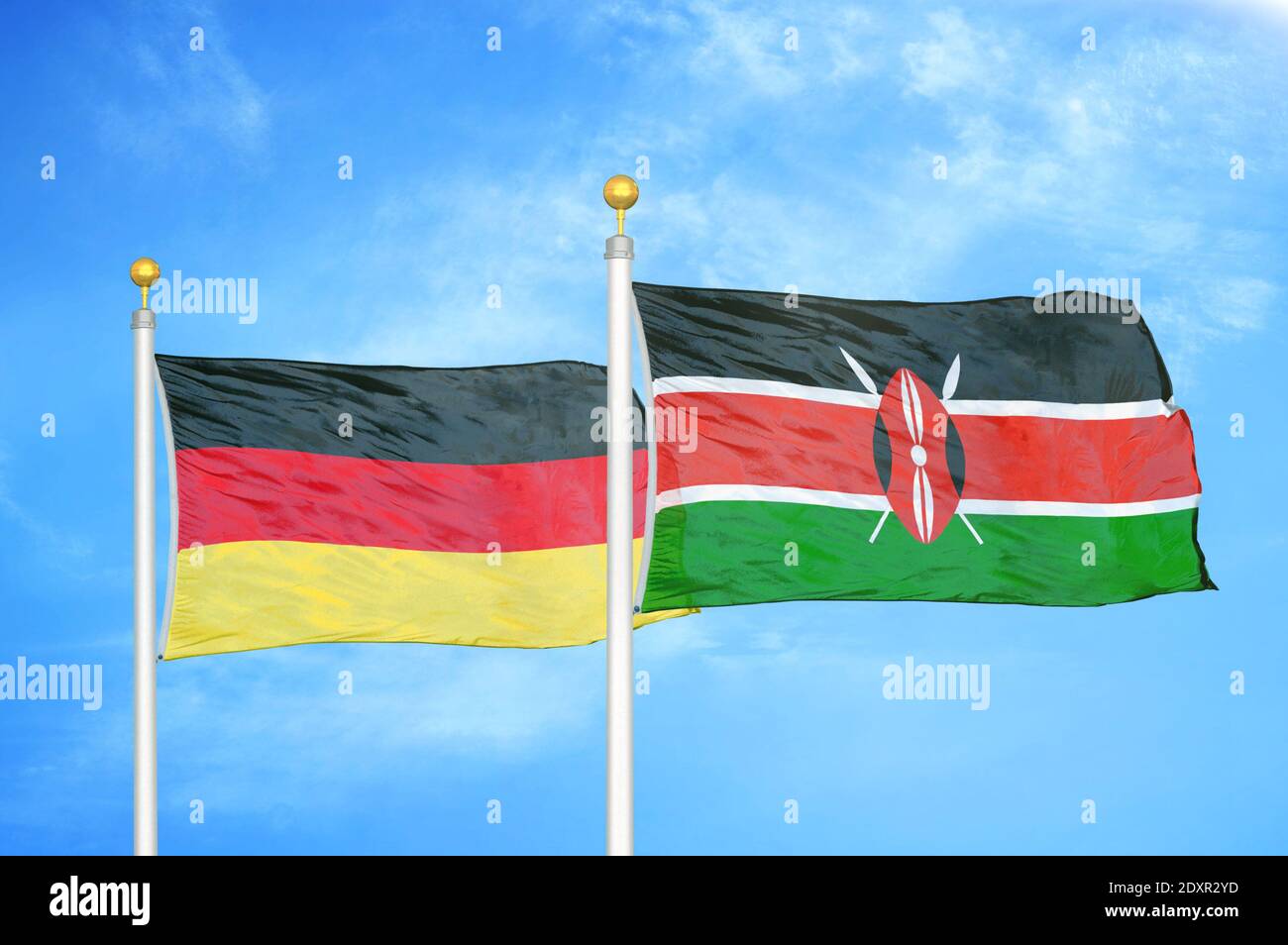 Germany and Kenya two flags on flagpoles and blue cloudy sky Stock ...