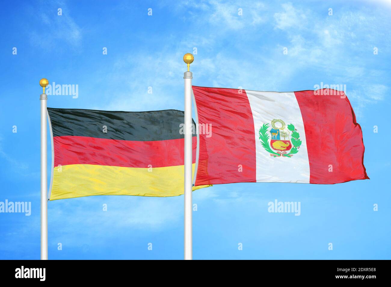 Germany and Peru two flags on flagpoles and blue cloudy sky Stock Photo ...
