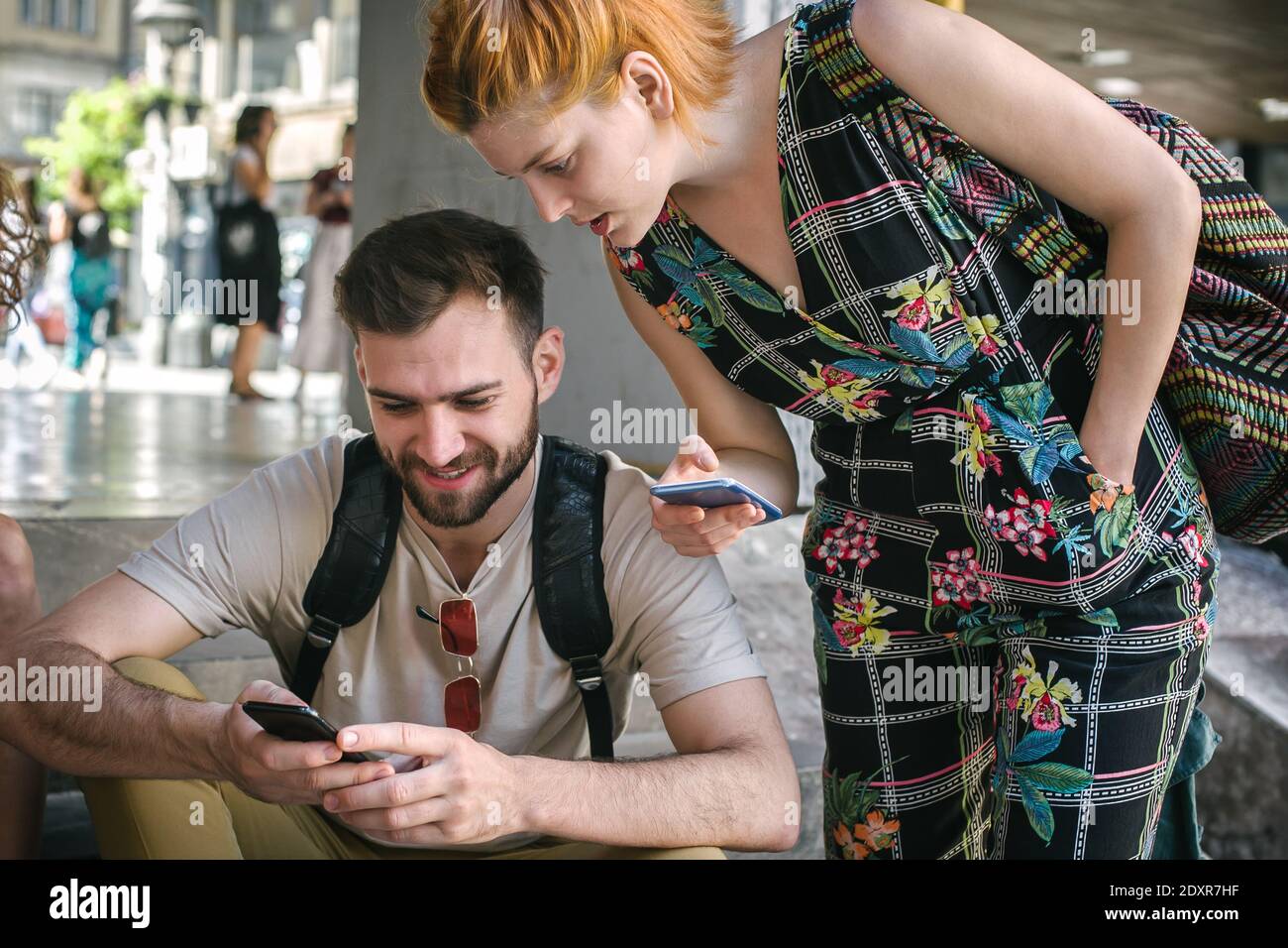 Group of friends using smartphones together. Young people addiction to ...