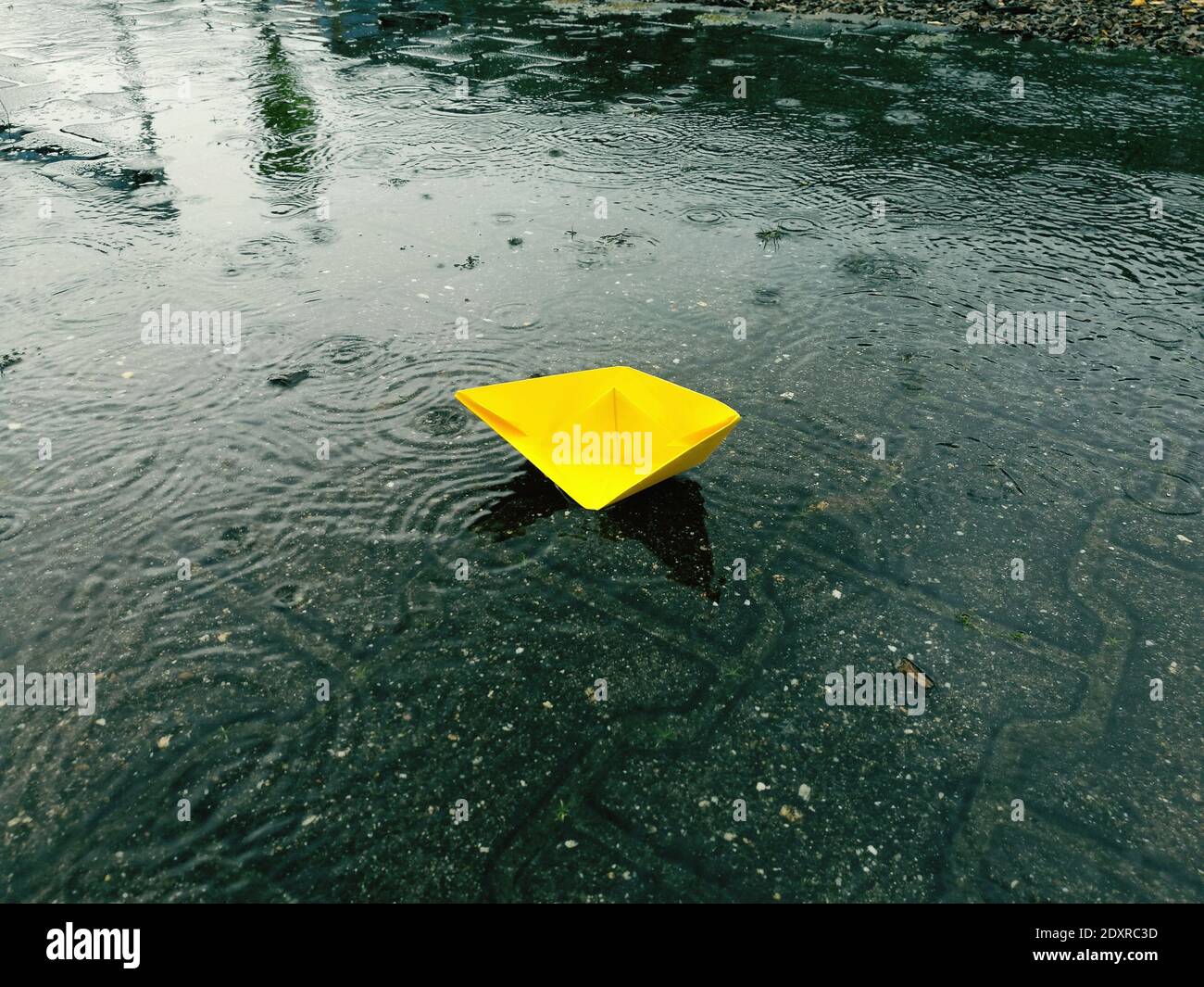 Paper boat puddle hi-res stock photography and images - Alamy