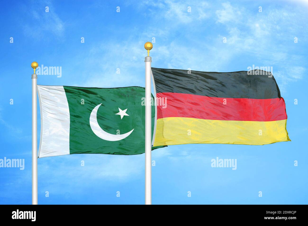 Pakistan and Germany two flags on flagpoles and blue cloudy sky Stock ...