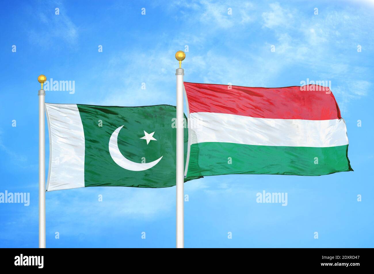 Pakistan and Hungary two flags on flagpoles and blue cloudy sky Stock ...