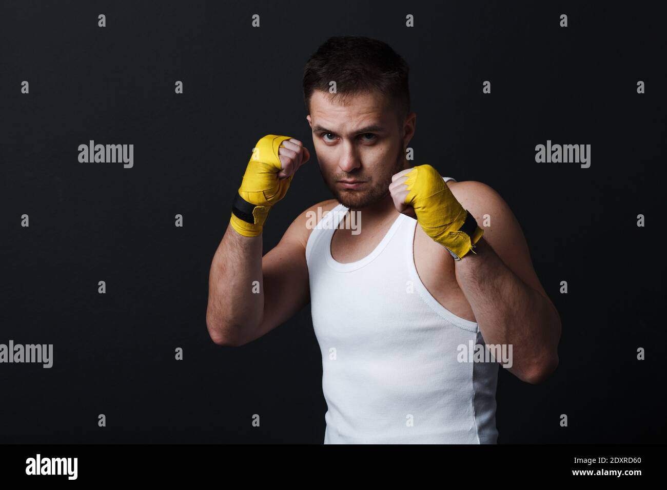 Man bare knuckle fighter stand at black background Stock Photo - Alamy