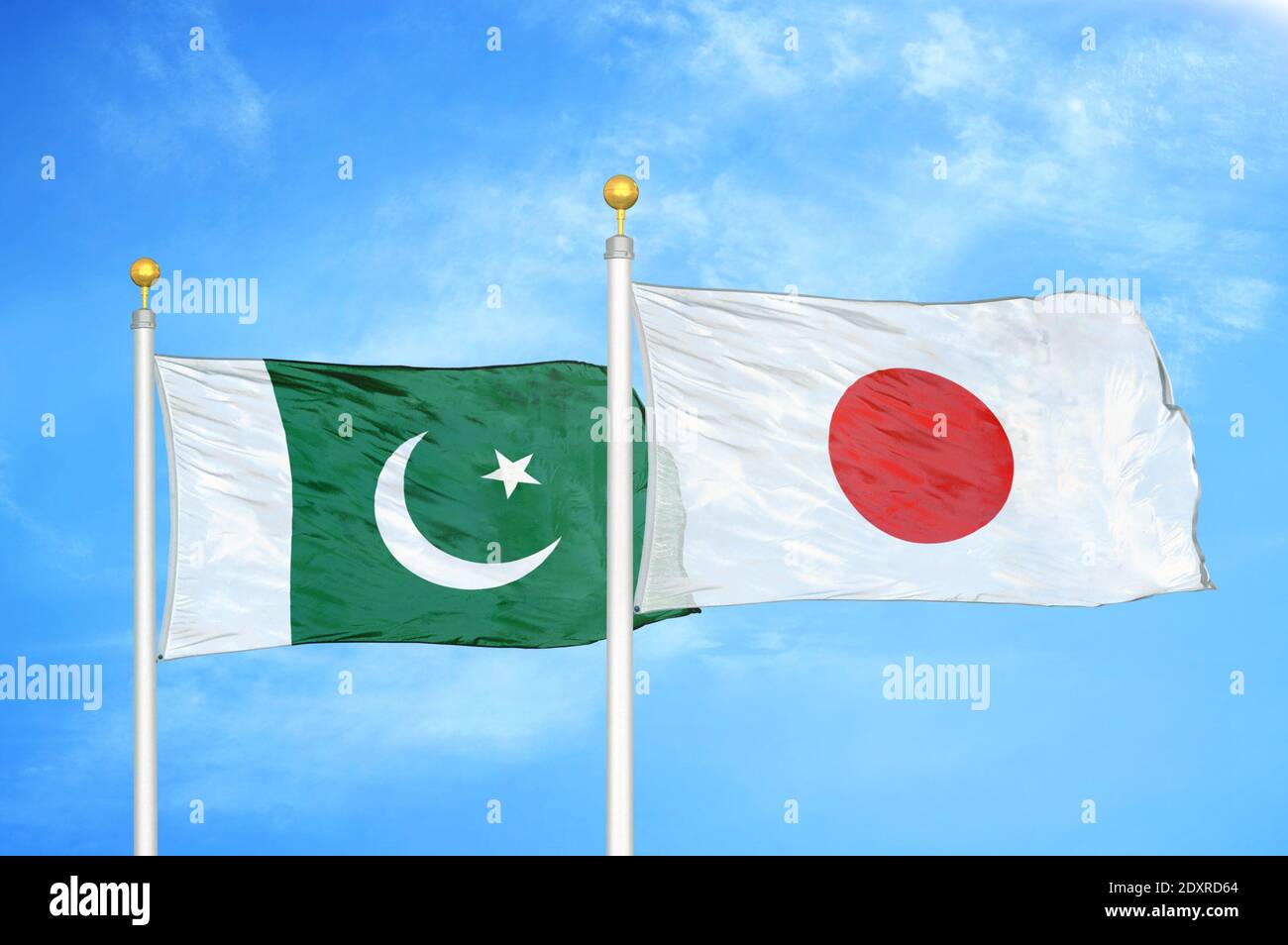 Pakistan and Japan two flags on flagpoles and blue cloudy sky Stock ...