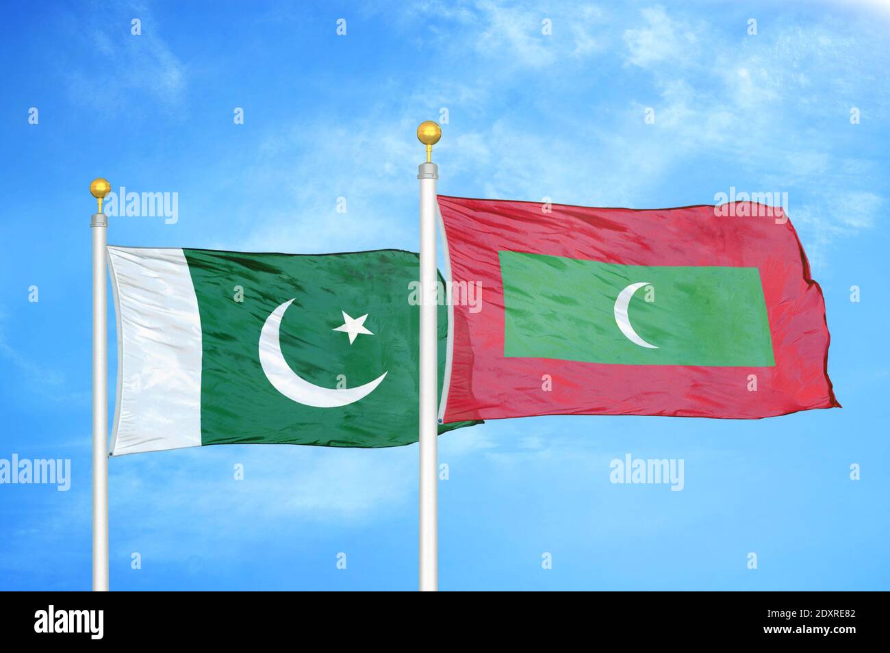Pakistan and Maldives two flags on flagpoles and blue cloudy sky Stock ...
