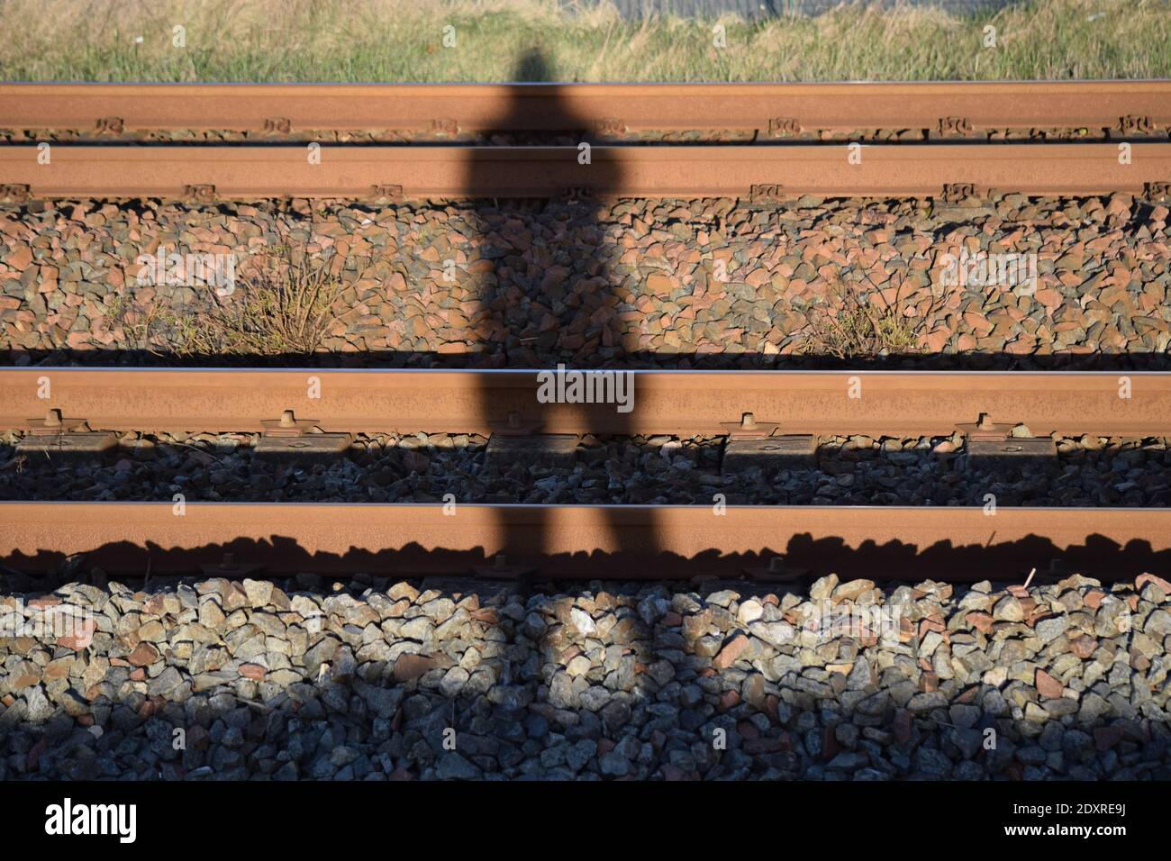 Shadow Of Person On Railroad Track Stock Photo - Alamy