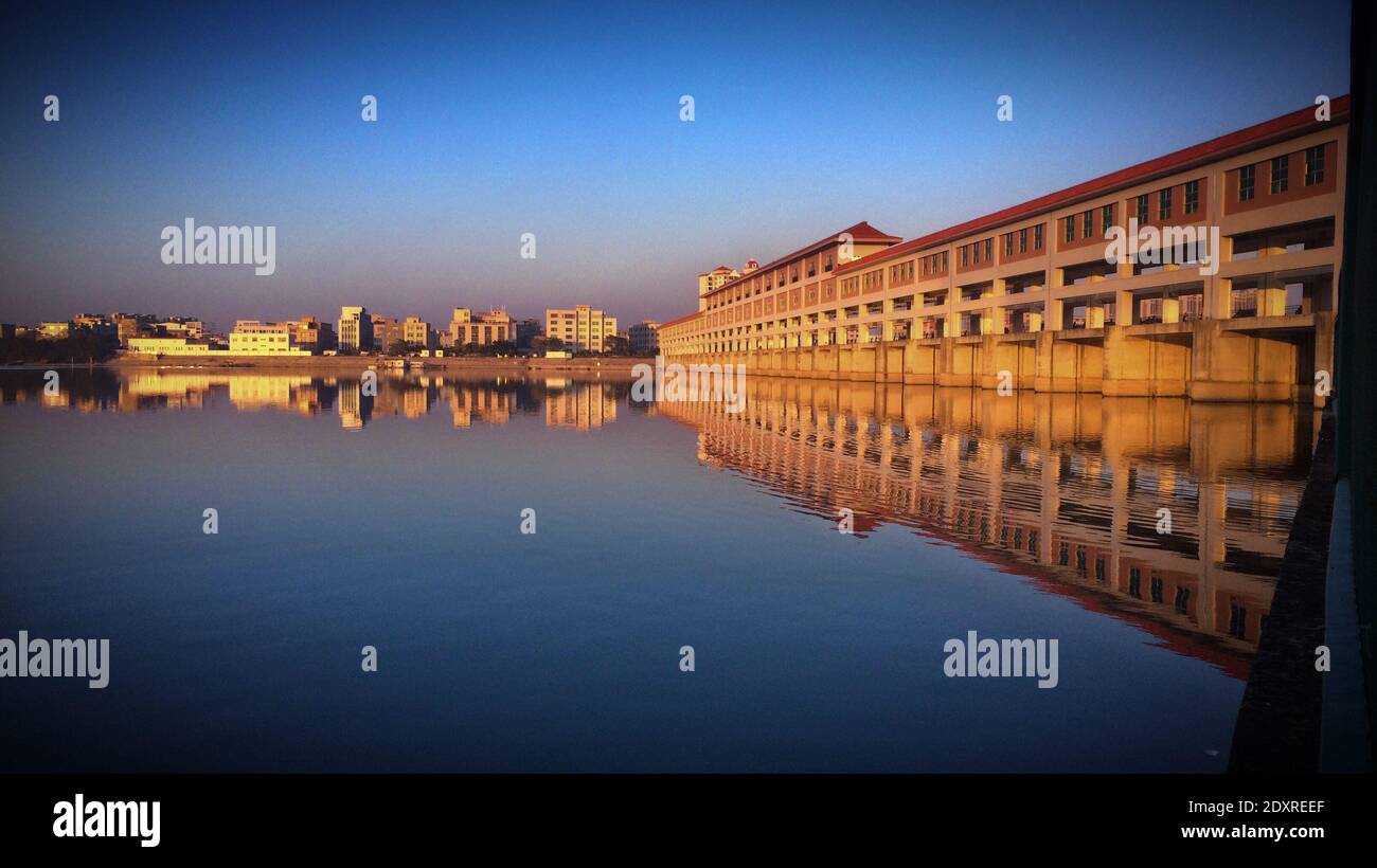 Reflection Of Buildings In Water Stock Photo - Alamy