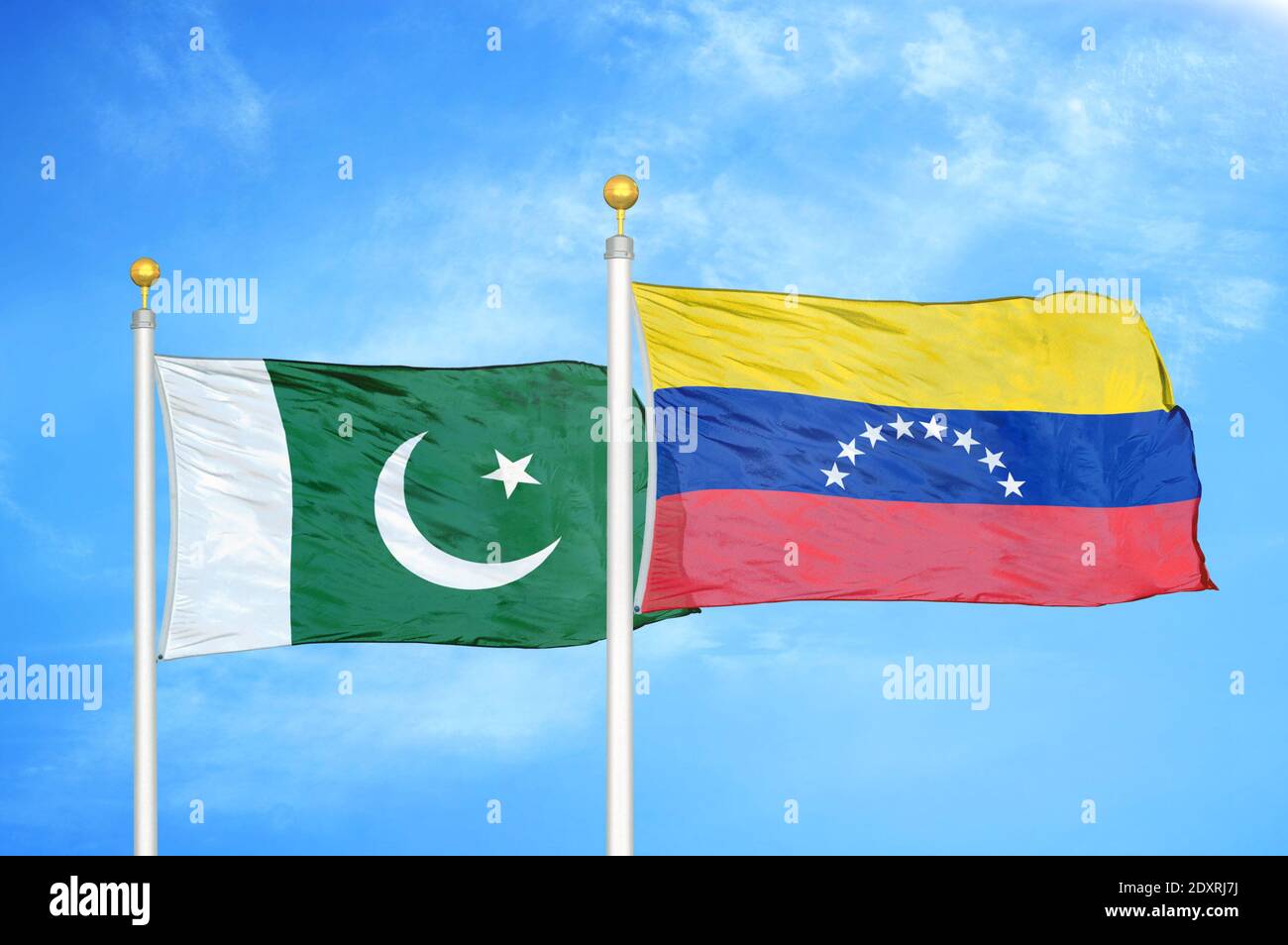 Pakistan and Venezuela two flags on flagpoles and blue cloudy sky Stock ...