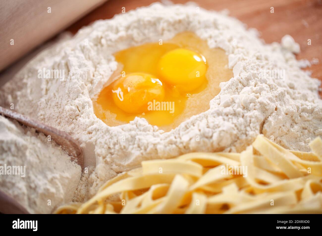 Flour and eggs as ingredients for making pasta dough Stock Photo - Alamy