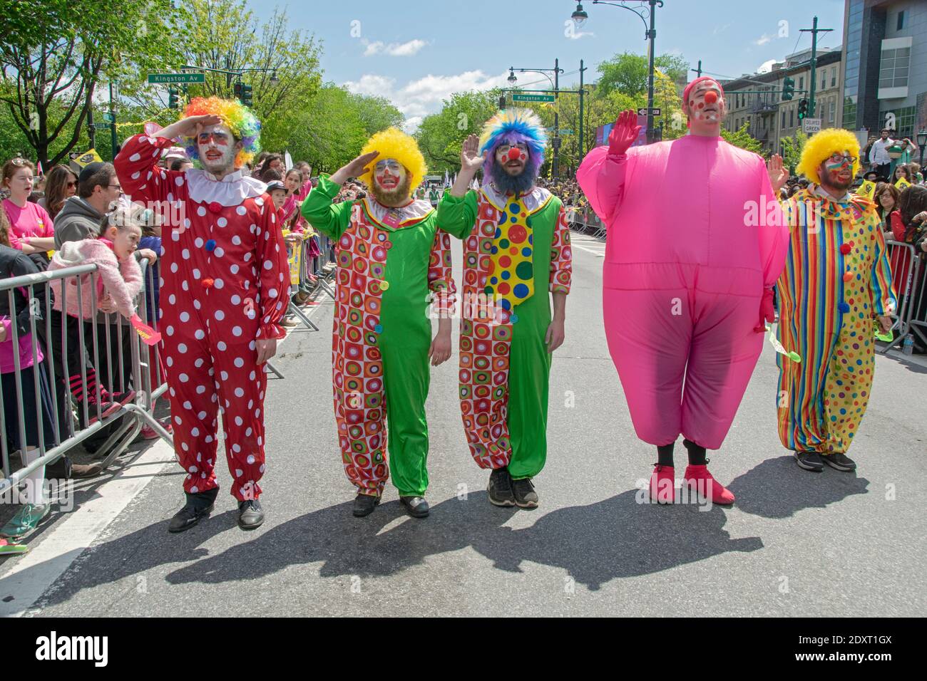 A 5 orthodox Jewish young men in costumes pose for a photo at the Lag B'Omer Day parade in Crown ...
