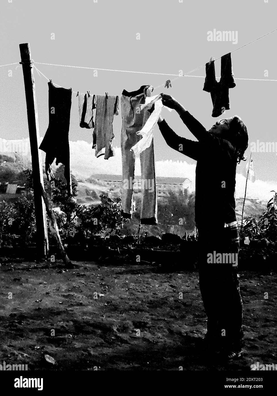 Laundry hanging clothesline drying Black and White Stock Photos ...