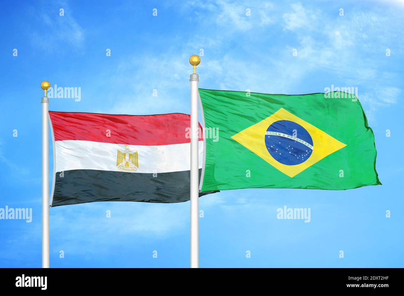 Egypt and Brazil two flags on flagpoles and blue cloudy sky Stock Photo ...