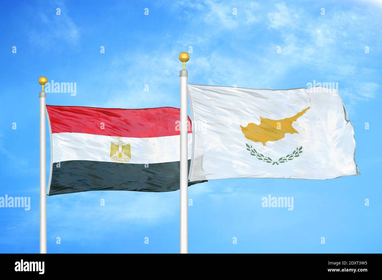 Egypt and Cyprus two flags on flagpoles and blue cloudy sky Stock Photo ...