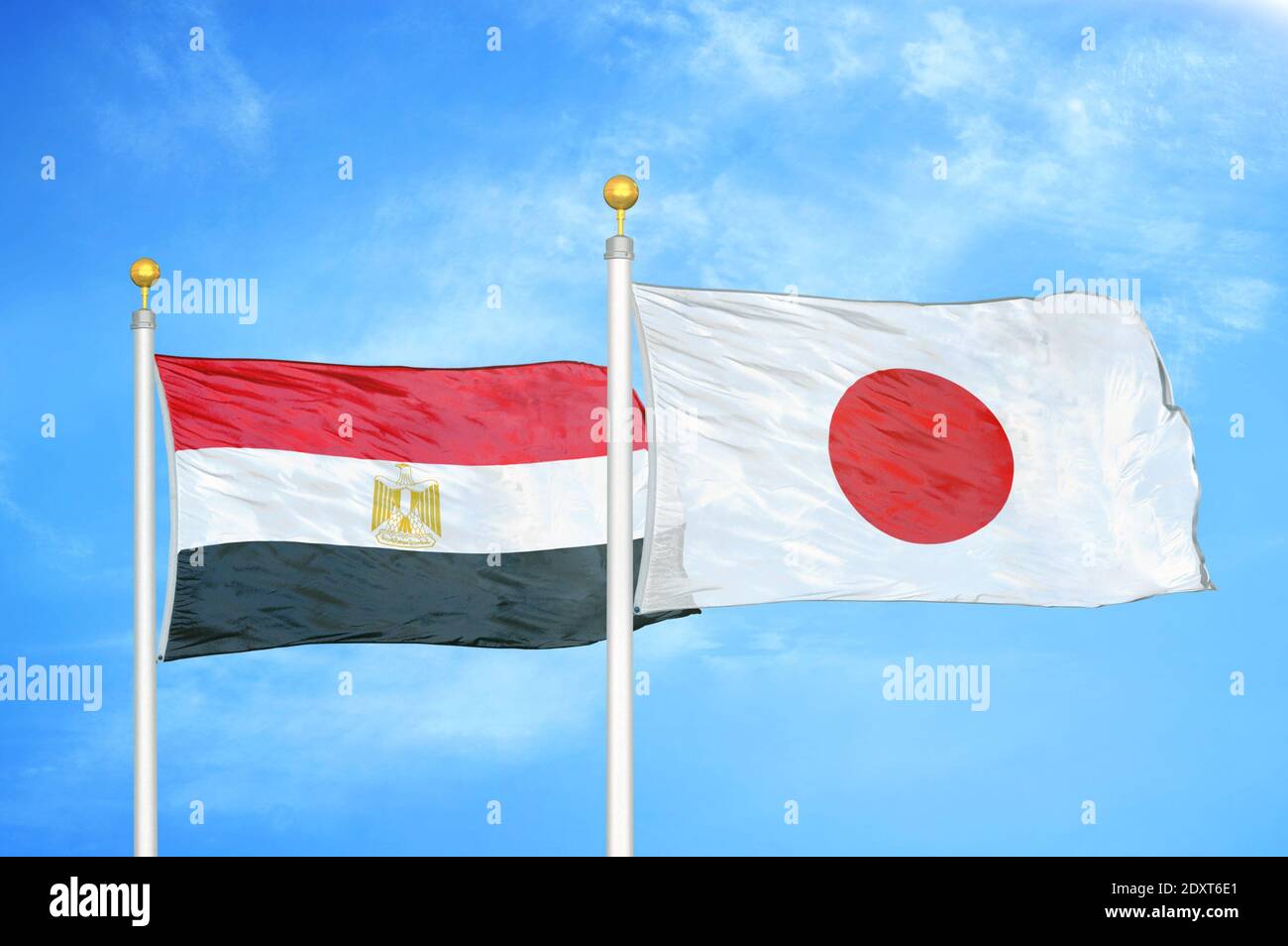 Egypt and Japan two flags on flagpoles and blue cloudy sky Stock Photo ...