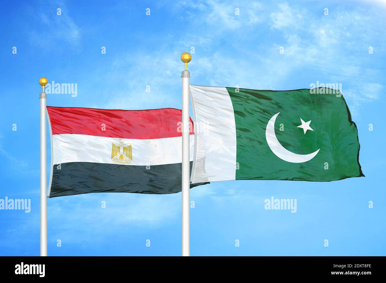 Egypt and Pakistan two flags on flagpoles and blue cloudy sky Stock ...