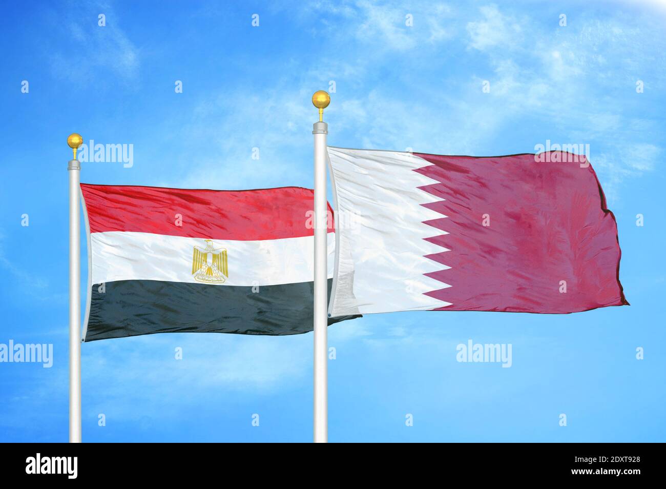 Egypt and Qatar two flags on flagpoles and blue cloudy sky Stock Photo ...