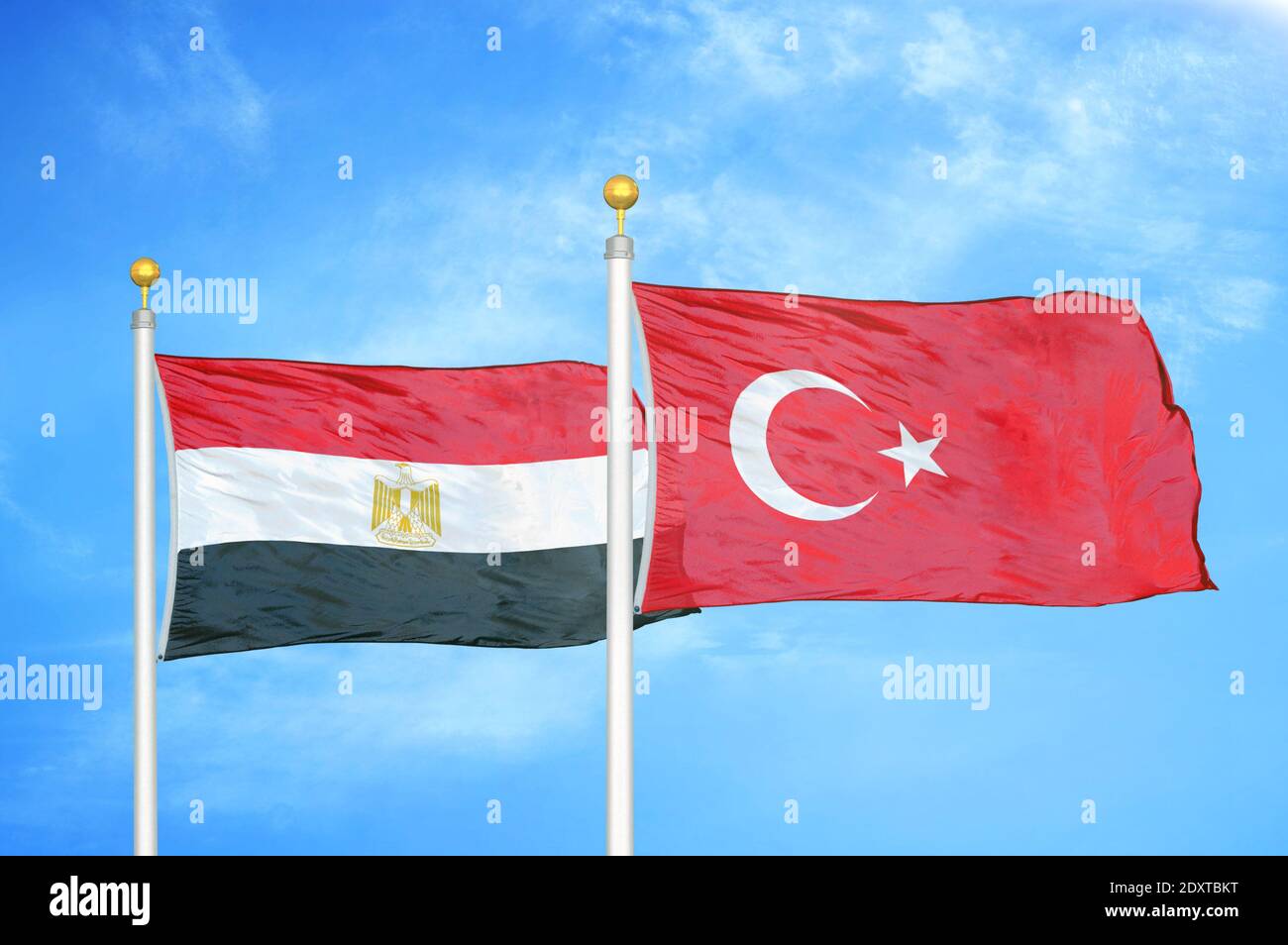Egypt and Turkey two flags on flagpoles and blue cloudy sky Stock Photo ...