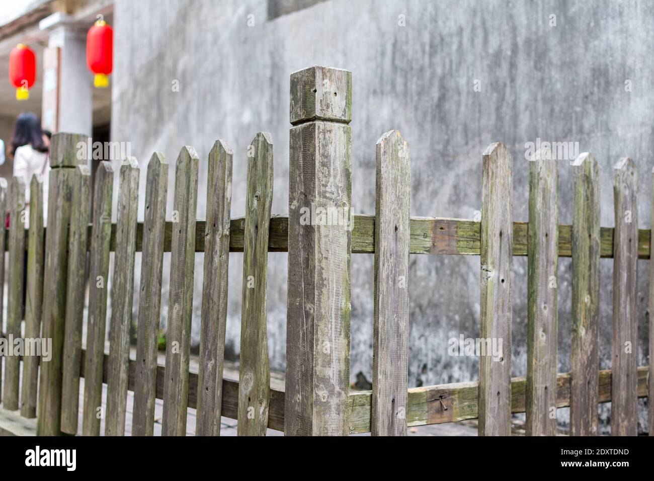 Wooden fence in front of traditional Chinese building, Hakka's Tulou ...