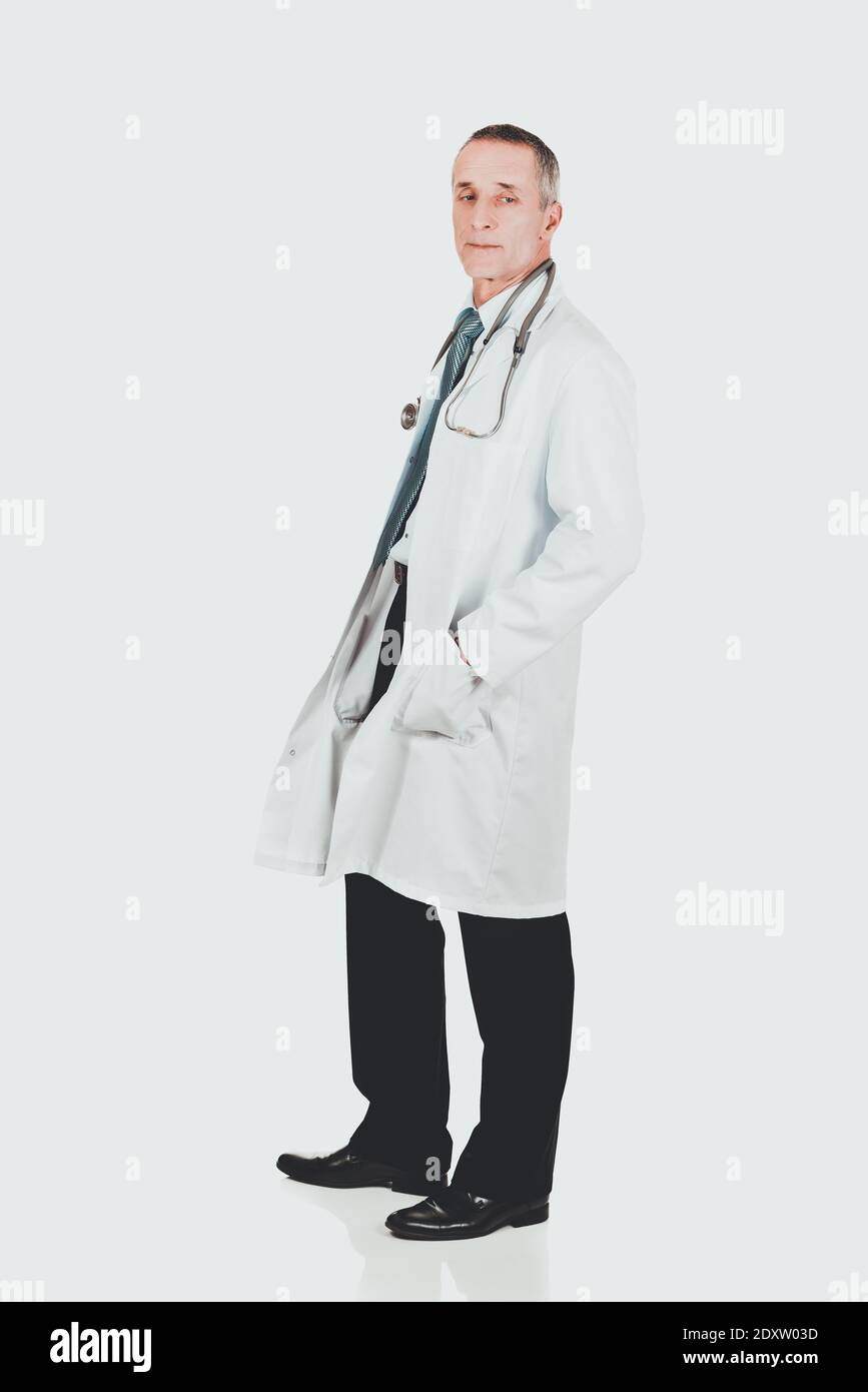 Full Length Portrait Of Doctor Standing Against White Background Stock ...