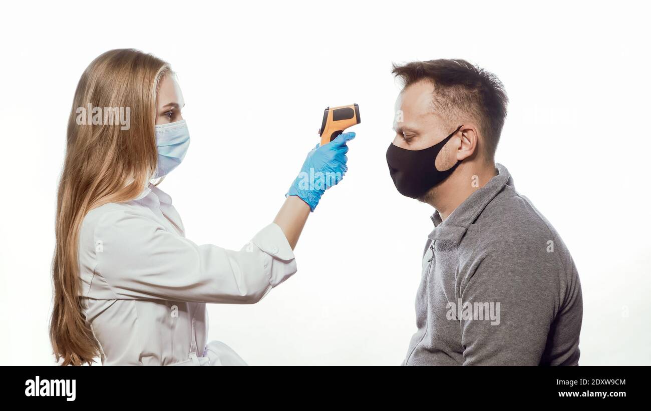 Checking patient body temperature test using a non-contact thermometer ...