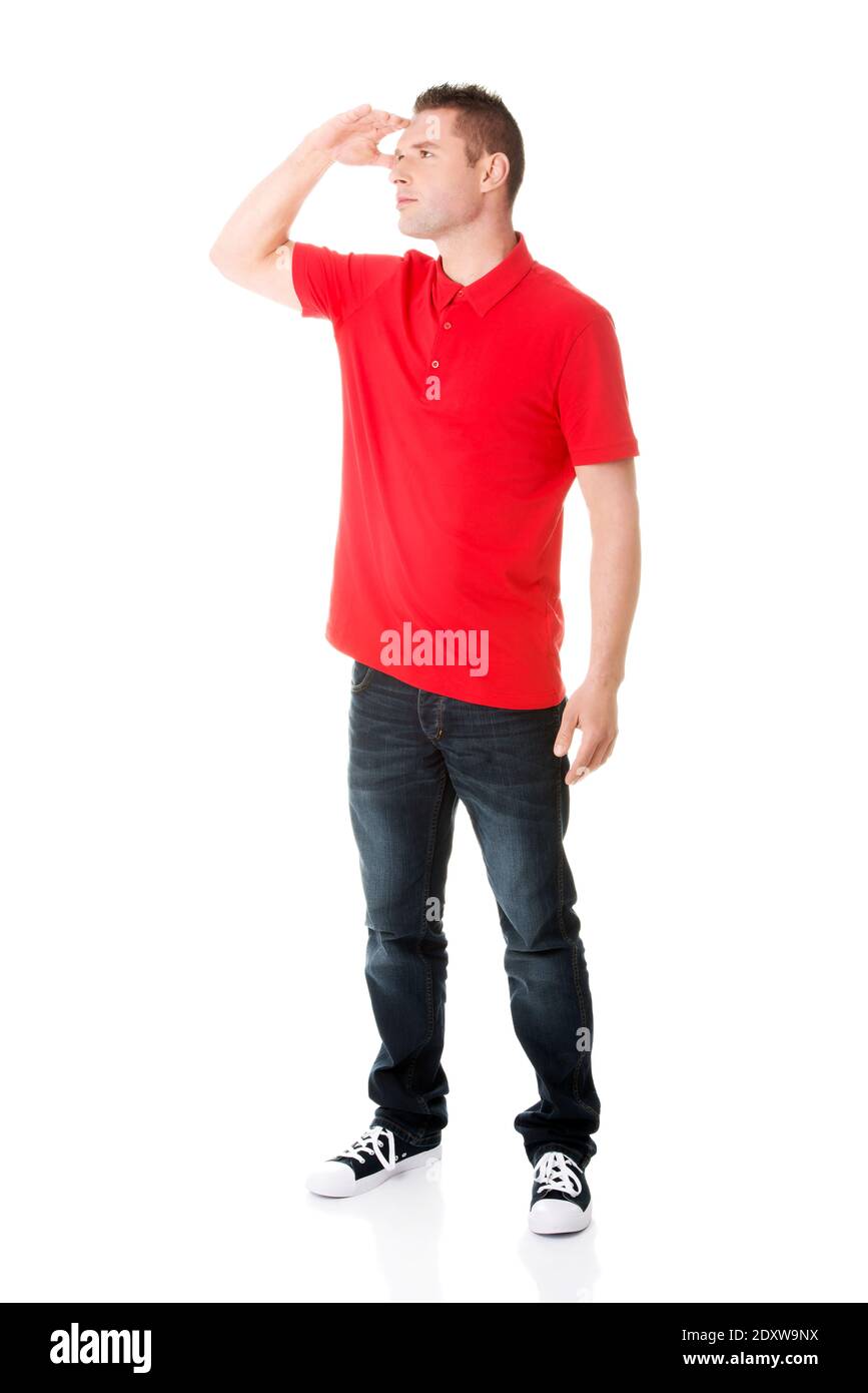 Full Length Of Mid Adult Man Shielding Eyes Against White Background ...