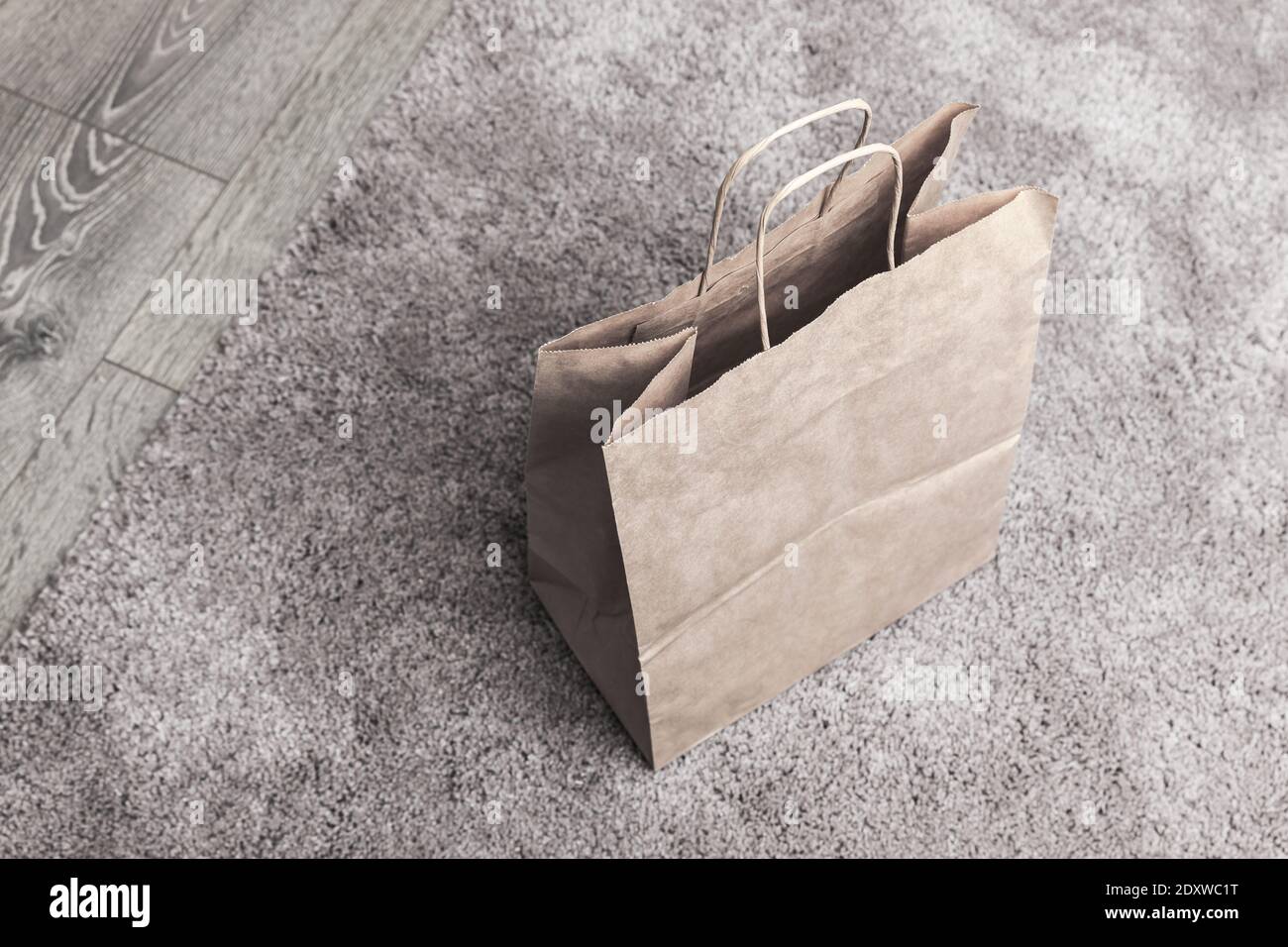Recycling paper bag stands on a gray carpet, top view Stock Photo - Alamy