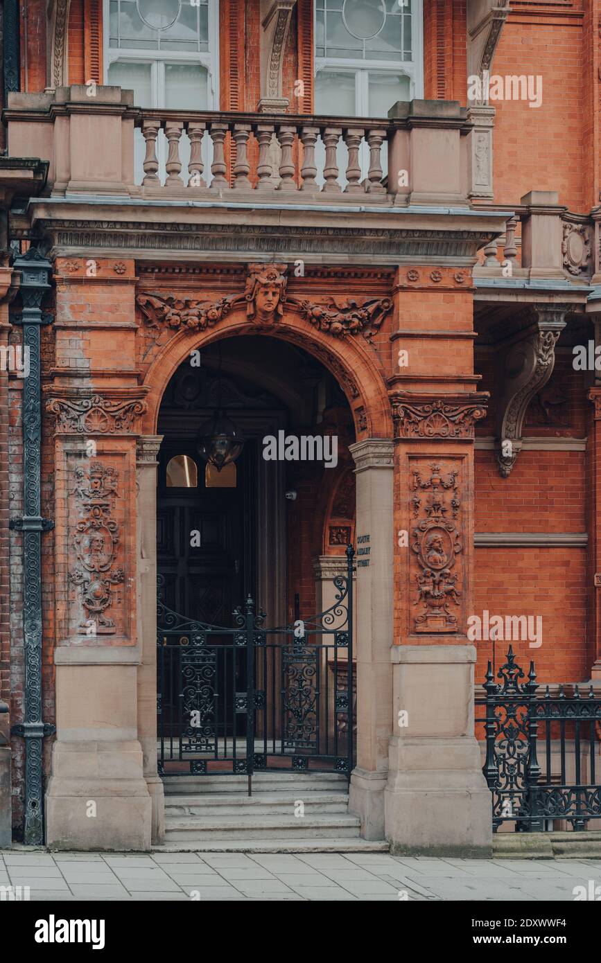 London, UK - December 5, 2020: Entrance of a traditional red brick ...